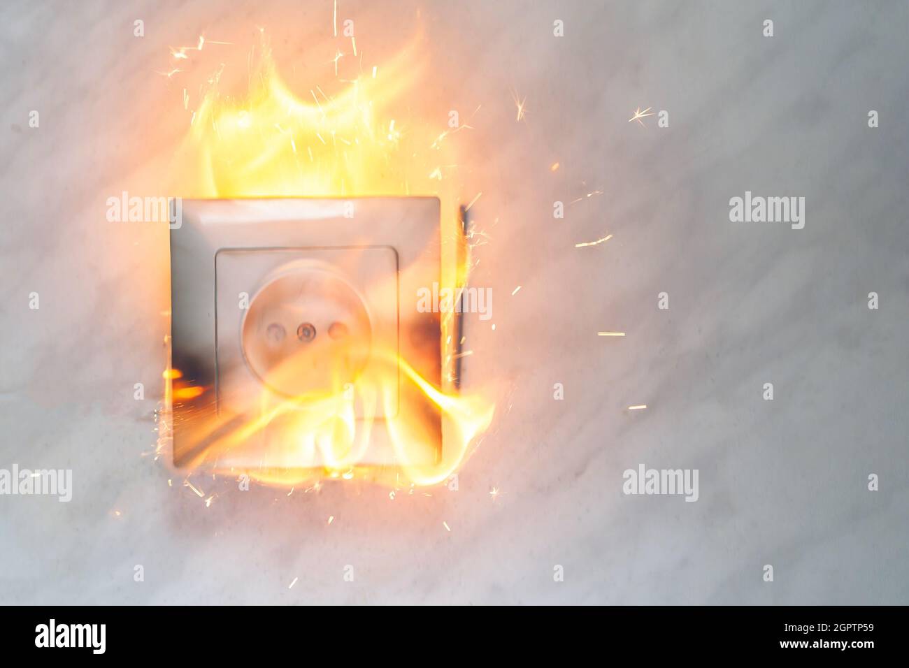 Short circuit of electrical wires sparks molten wires, fire from ...