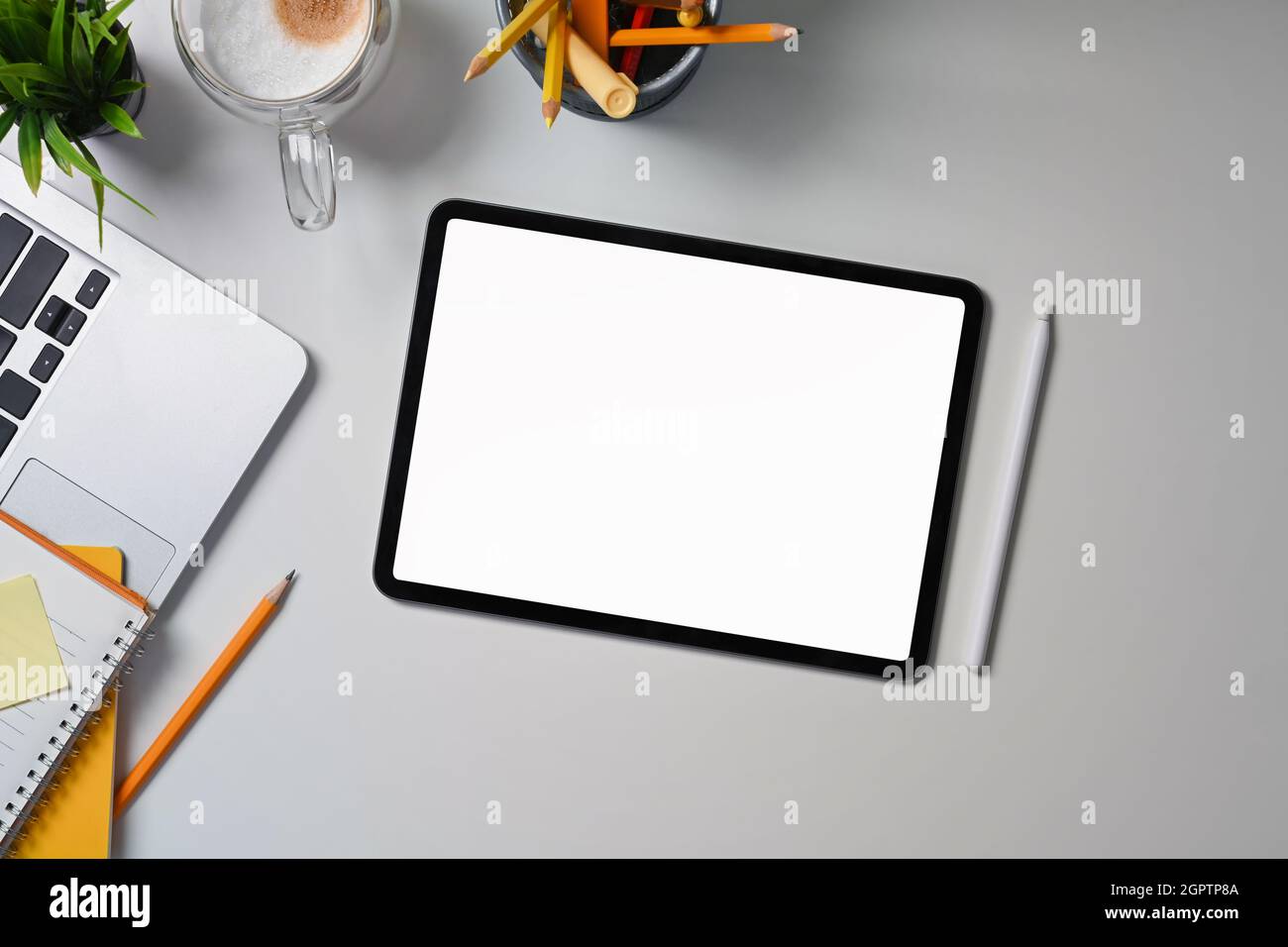 Top view digital tablet, stylus pen, laptop computer and stationery on ...