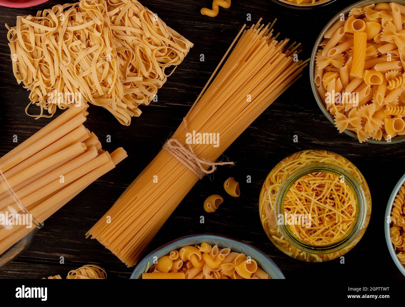 top view of different types of macaroni as bucatini spaghetti ...