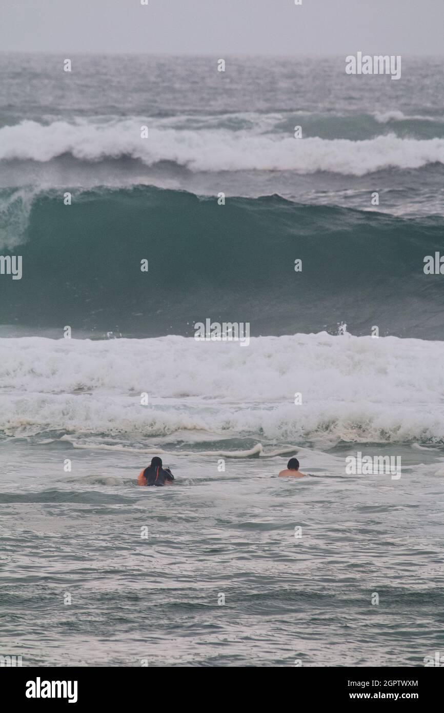 Two surfers on boards floating hi-res stock photography and images - Alamy