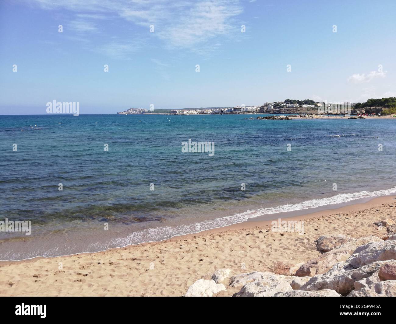 Beautiful shot of a beach being washed off by the waves of a sea Stock ...