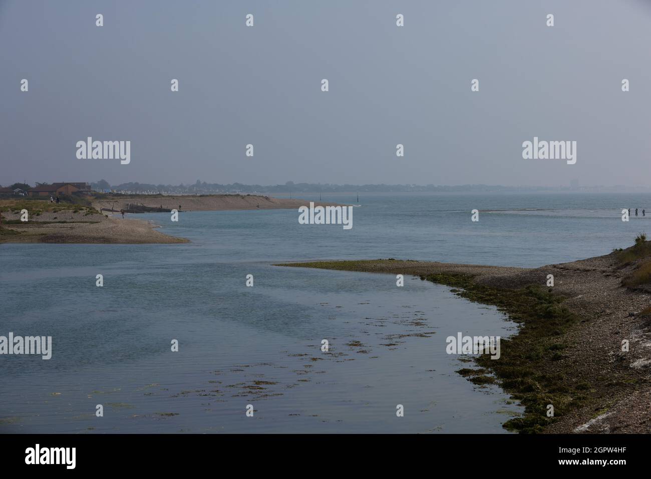 Wide stream of water seen at Pagham beach UK Stock Photo - Alamy