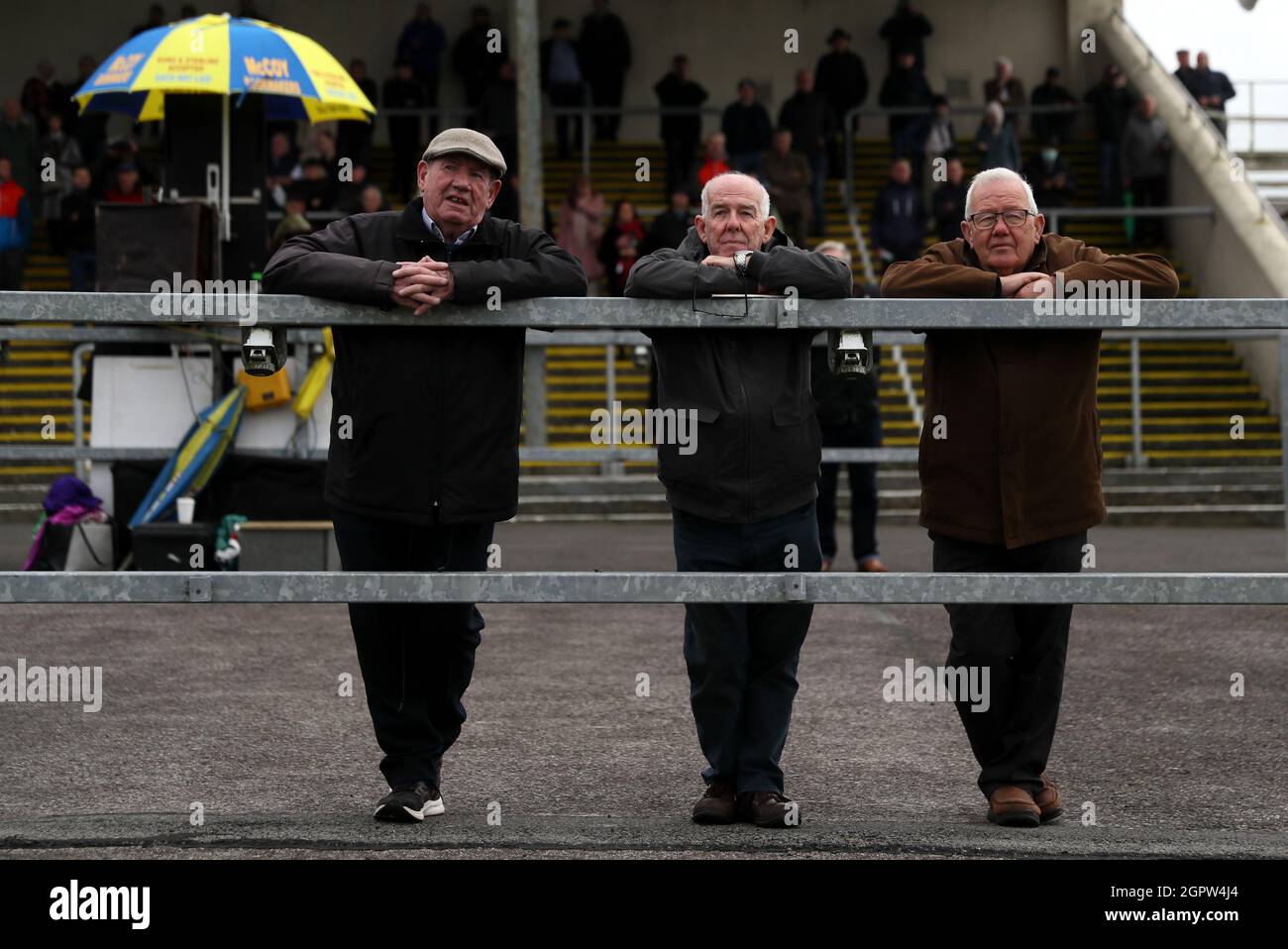 Racegoers watch the big screen at Bellewstown Racecourse in County ...