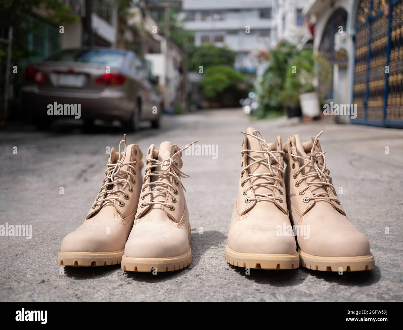 Front View Of Male And Female Boots Are Placed In The Middle Of The ...