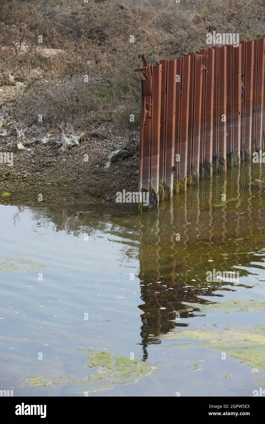 Rusty and neglected metal sea defences seen on the coast of Pagham ...
