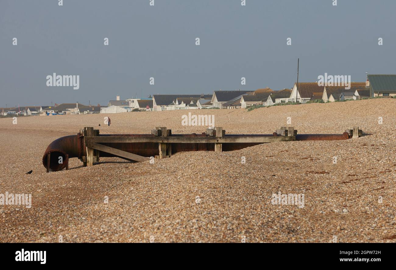 Large rusty water outlet seen on the beach of Aldham, UK in summer 2021 ...