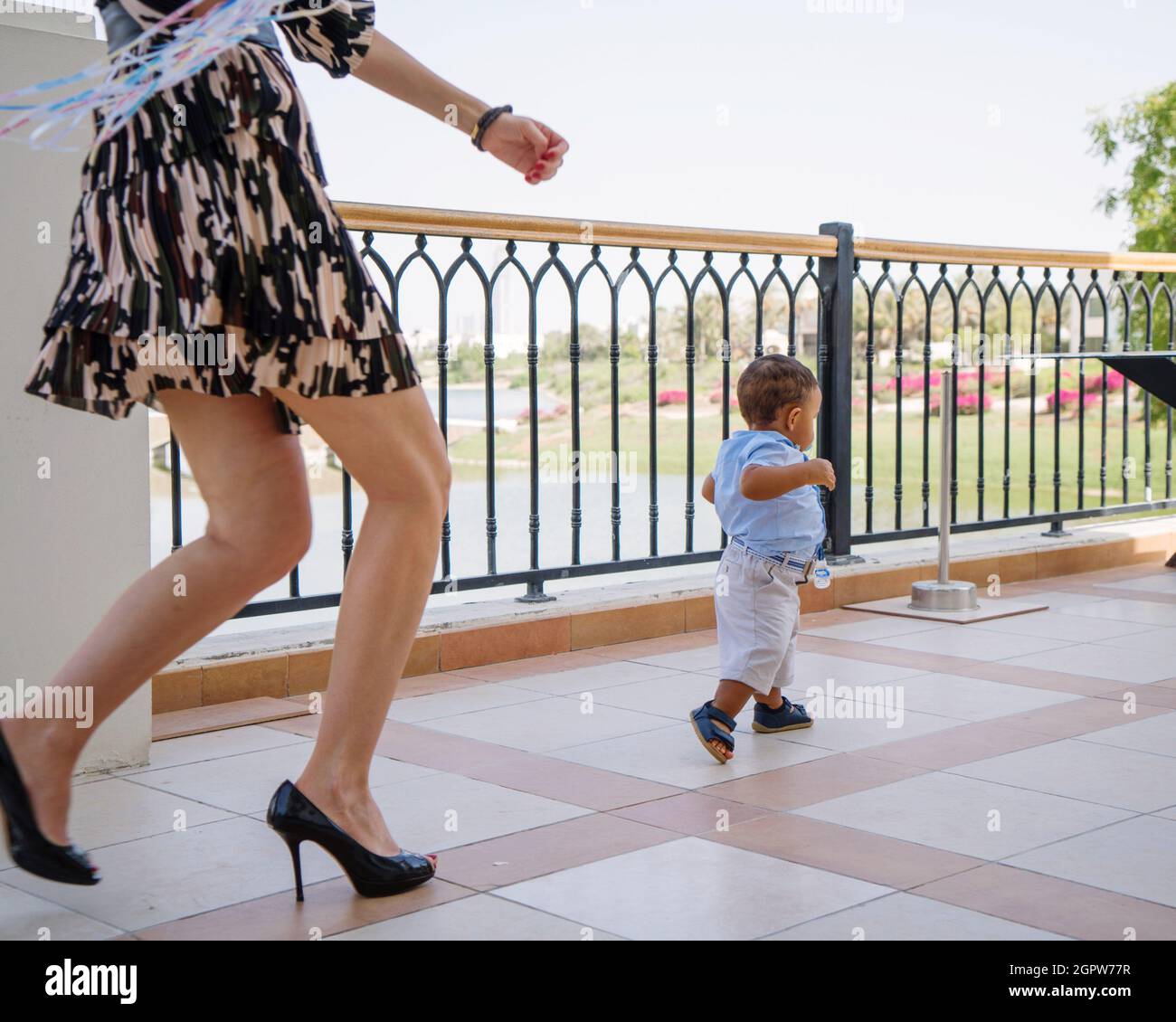 Boy running after mother hi-res stock photography and images - Alamy