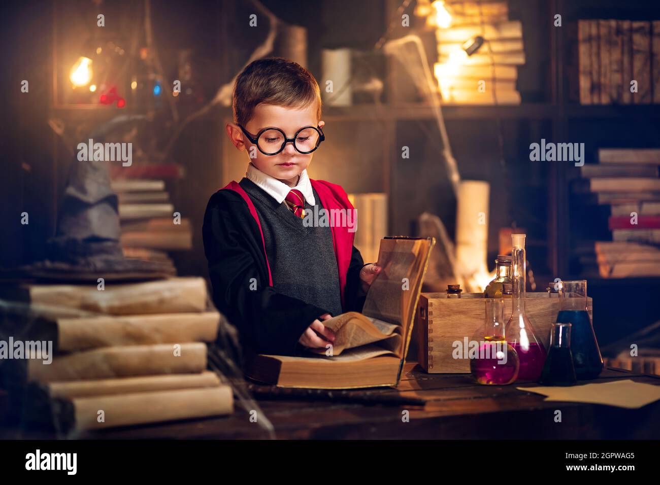 Small wizard reads magic book Cosplay Harry Potter. Halloween holiday ...