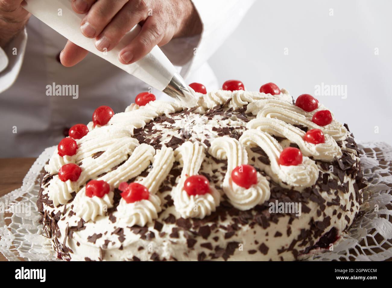 Man decorating cake closeup hi-res stock photography and images - Alamy