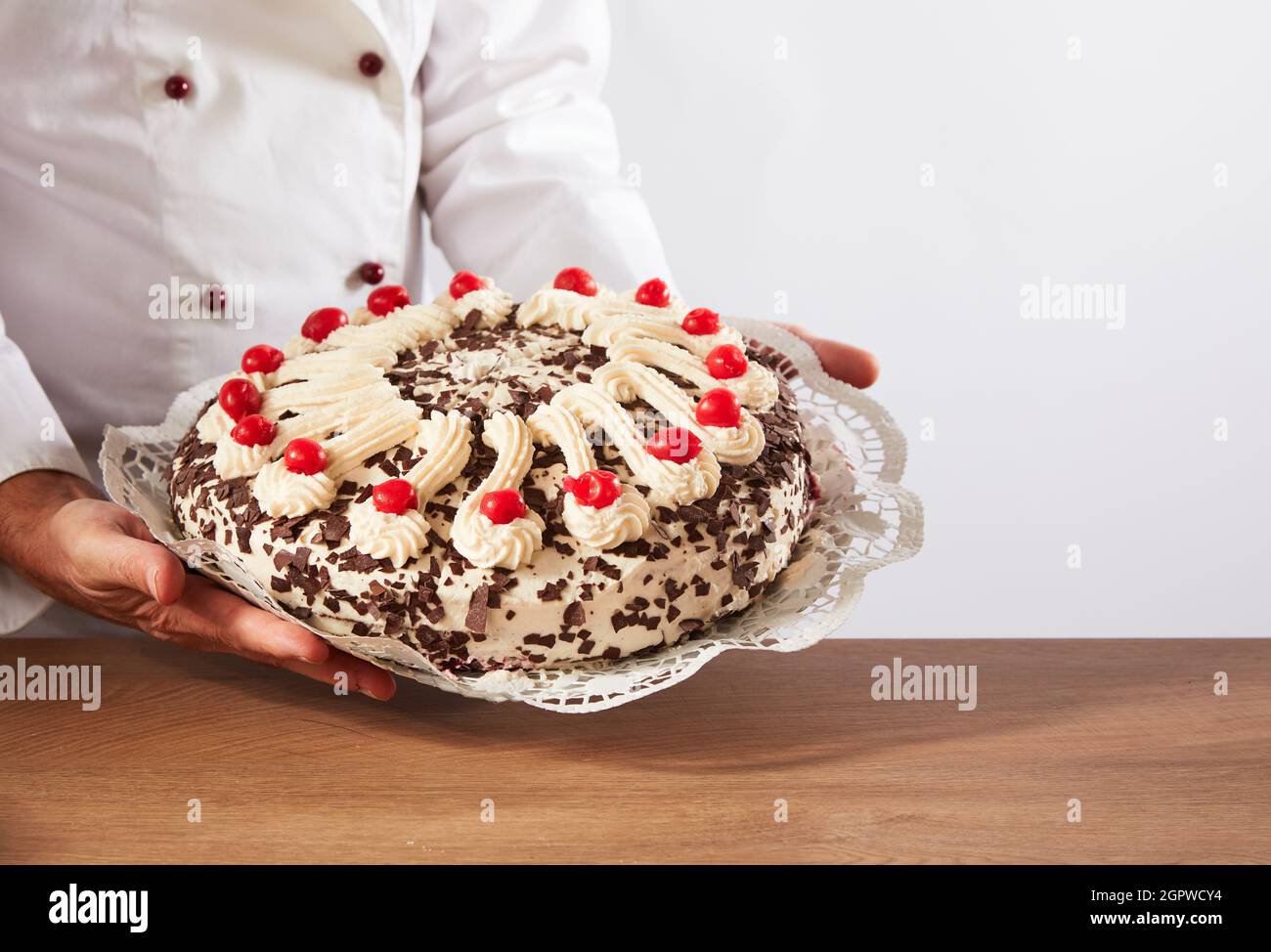Man serving a tasty cake Stock Photo - Alamy
