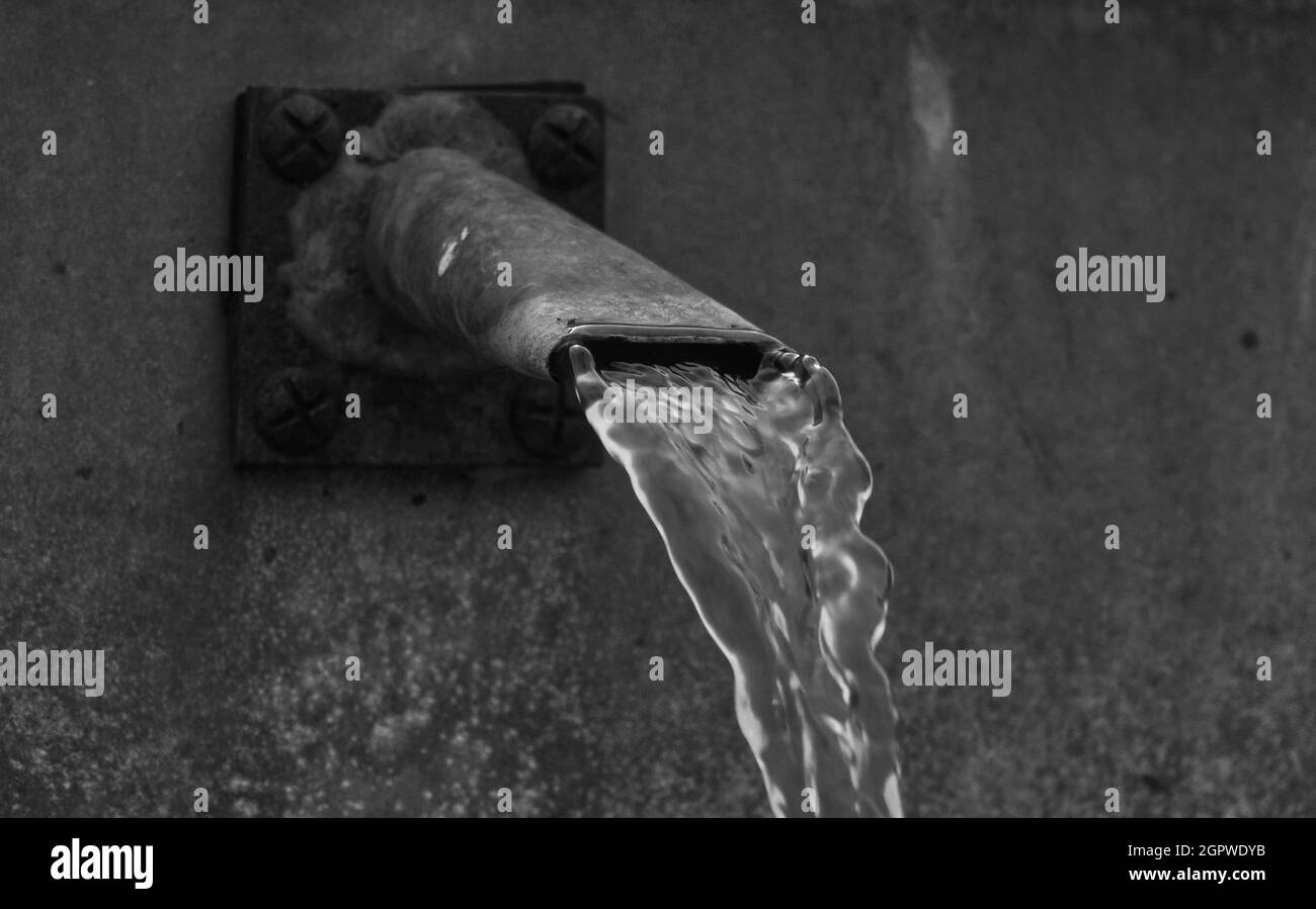 Water pouring from pipe Black and White Stock Photos & Images - Alamy