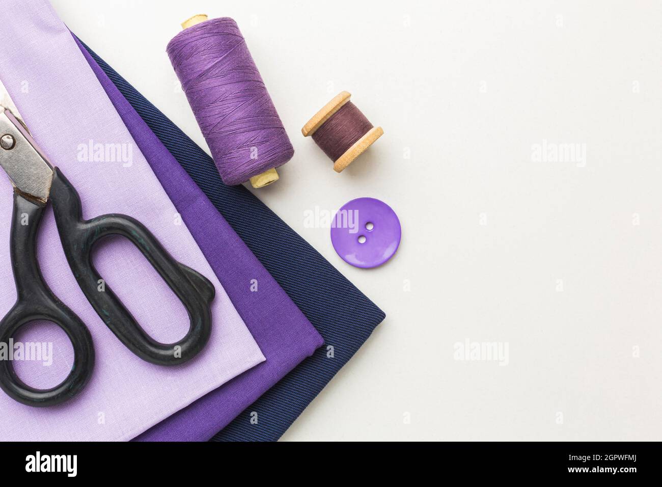 Top view fabrics with notebook thread Stock Photo - Alamy