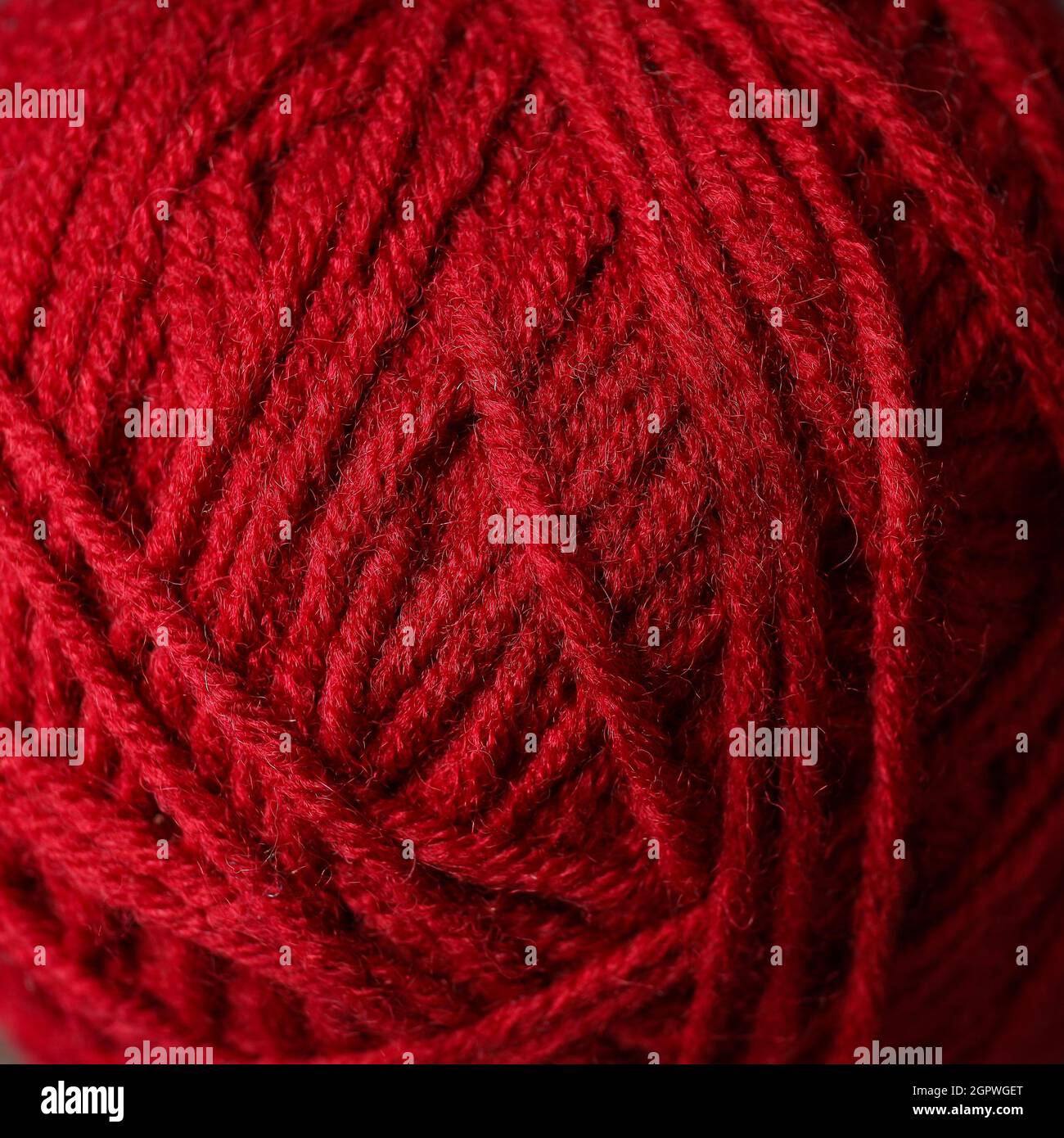 Red ball of yarn all over background, closeup Stock Photo - Alamy
