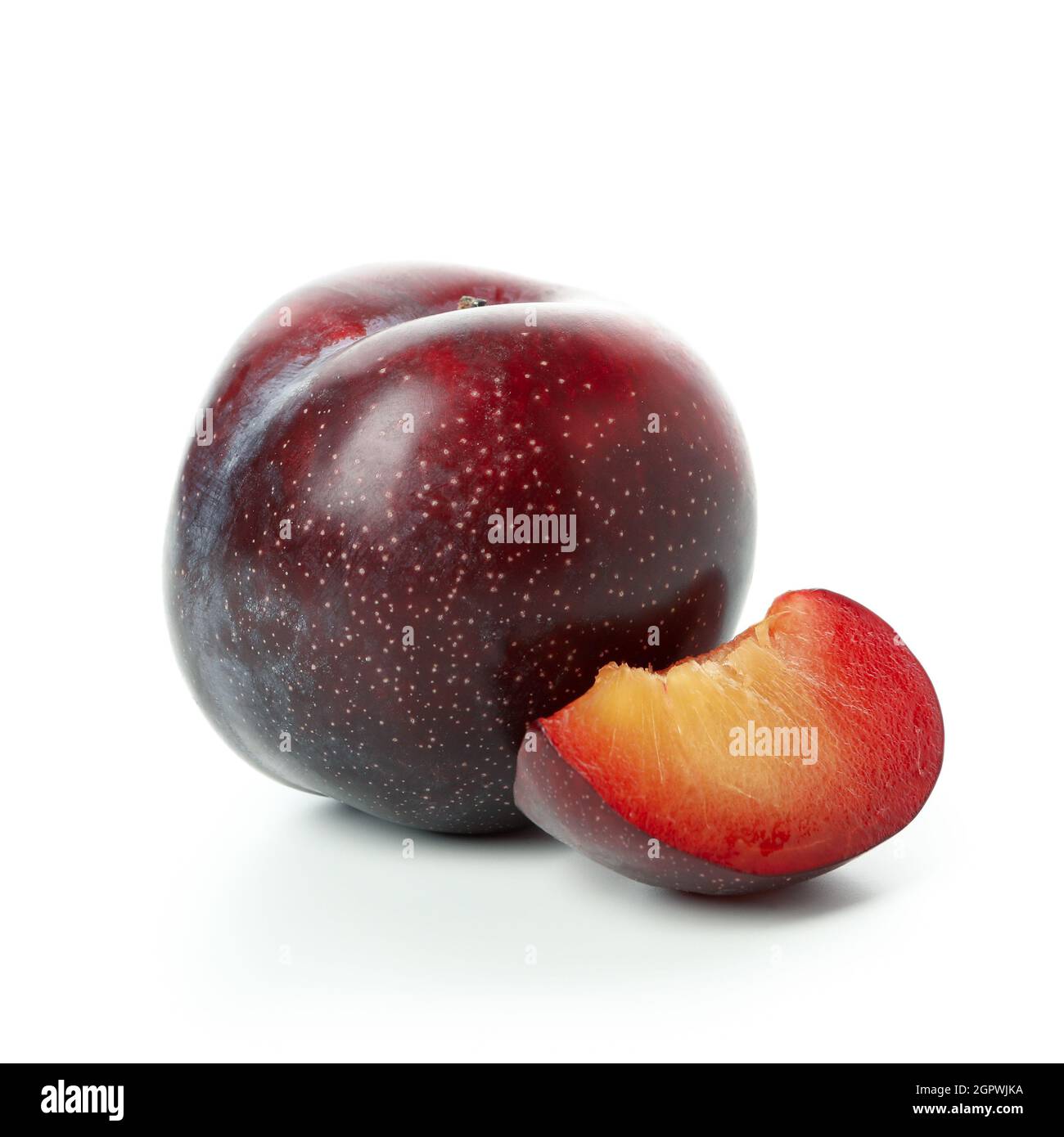 Plum with slice isolated on white background Stock Photo - Alamy