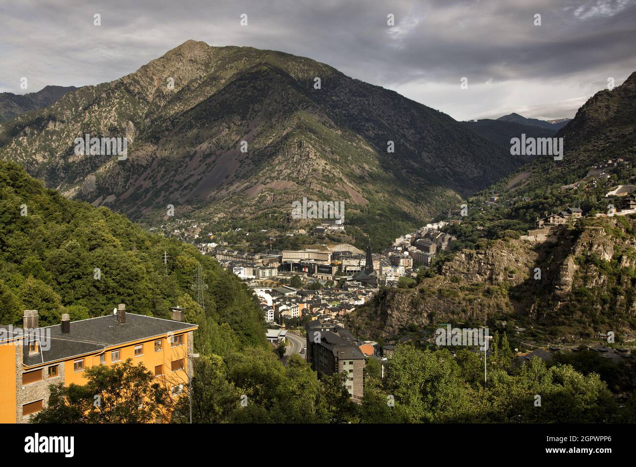 Mesmerizing view of forested mountains and buildings in Andorra city ...