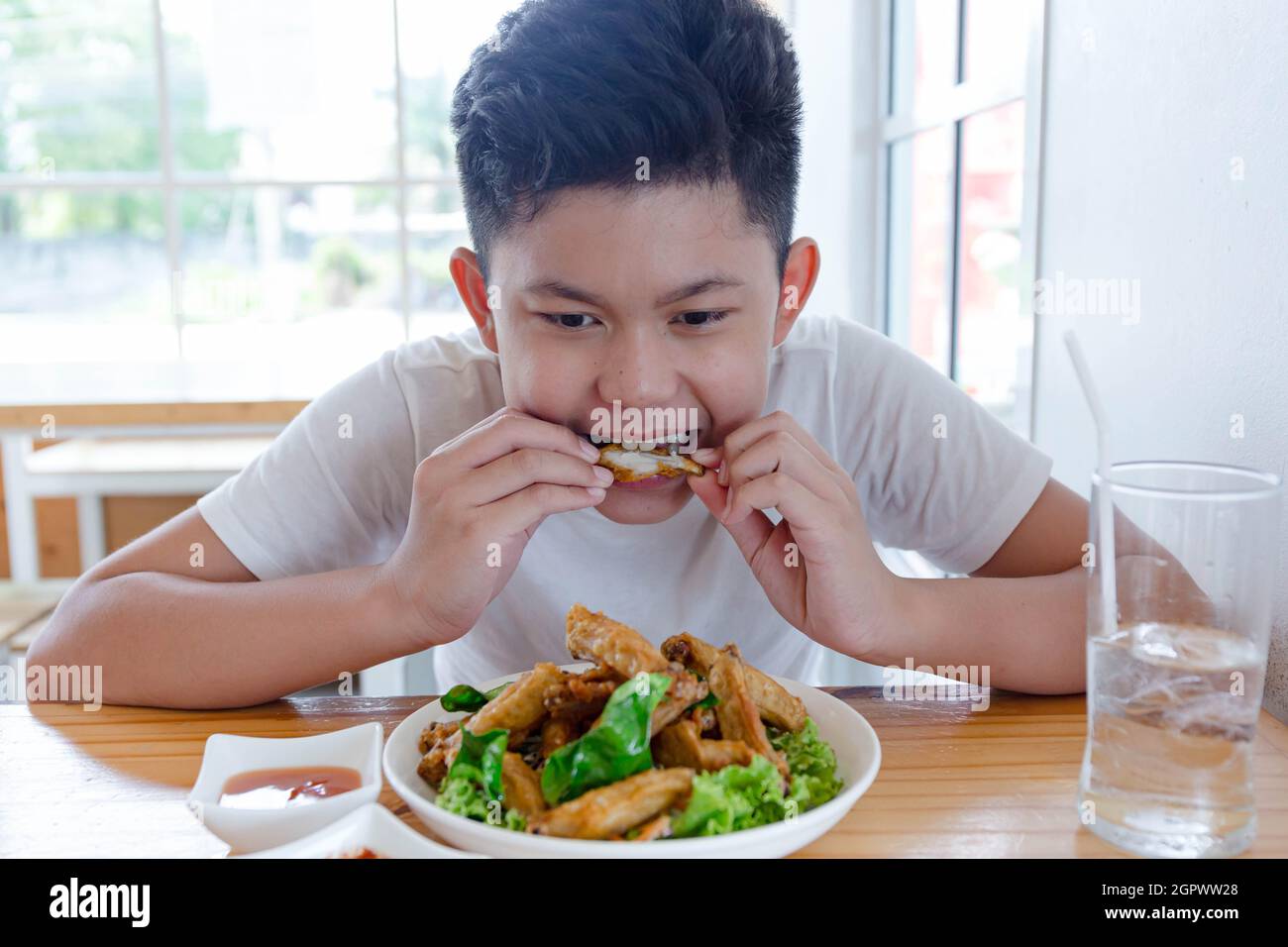 Boy chicken sandwich hi-res stock photography and images - Alamy