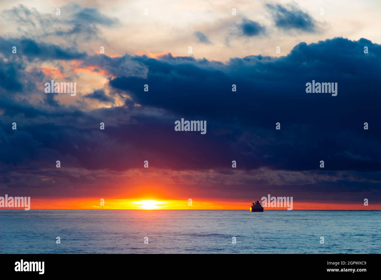 Sea Sunset Landscape With Ship On The Horizon Stock Photo - Alamy