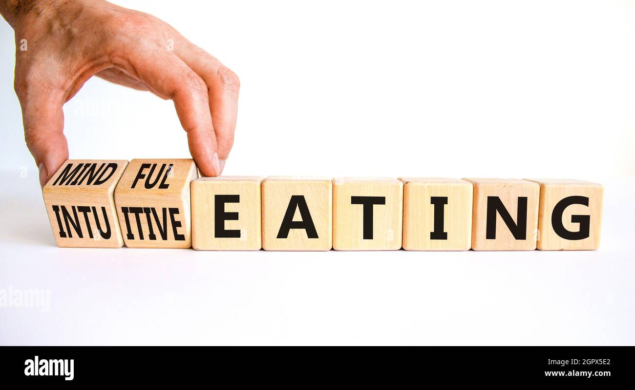 Mindful or intuitive eating symbol. Doctor turns cubes and changes ...