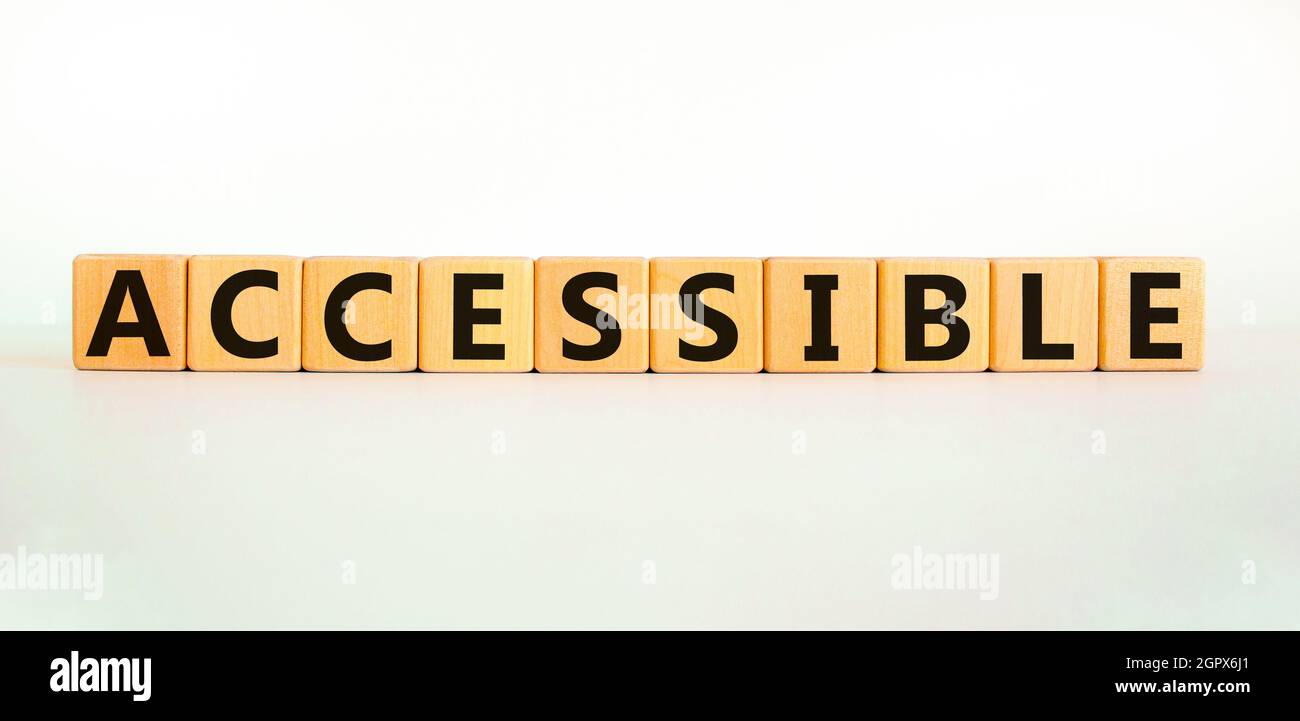 Accessible symbol. The word accessible on wooden cubes. Beautiful white ...