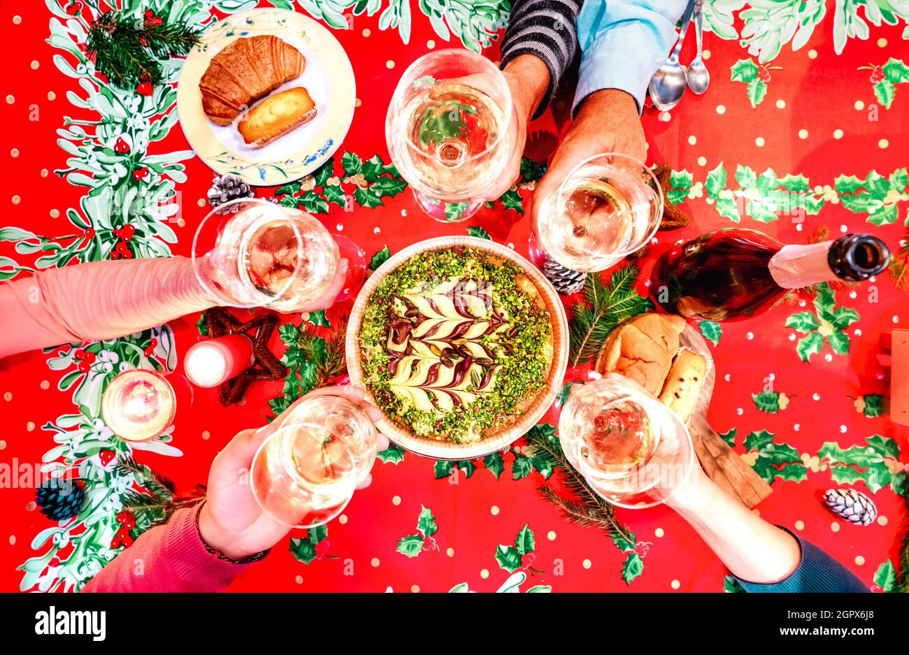 Top view of family hands toasting champagne glass at Christmas house ...