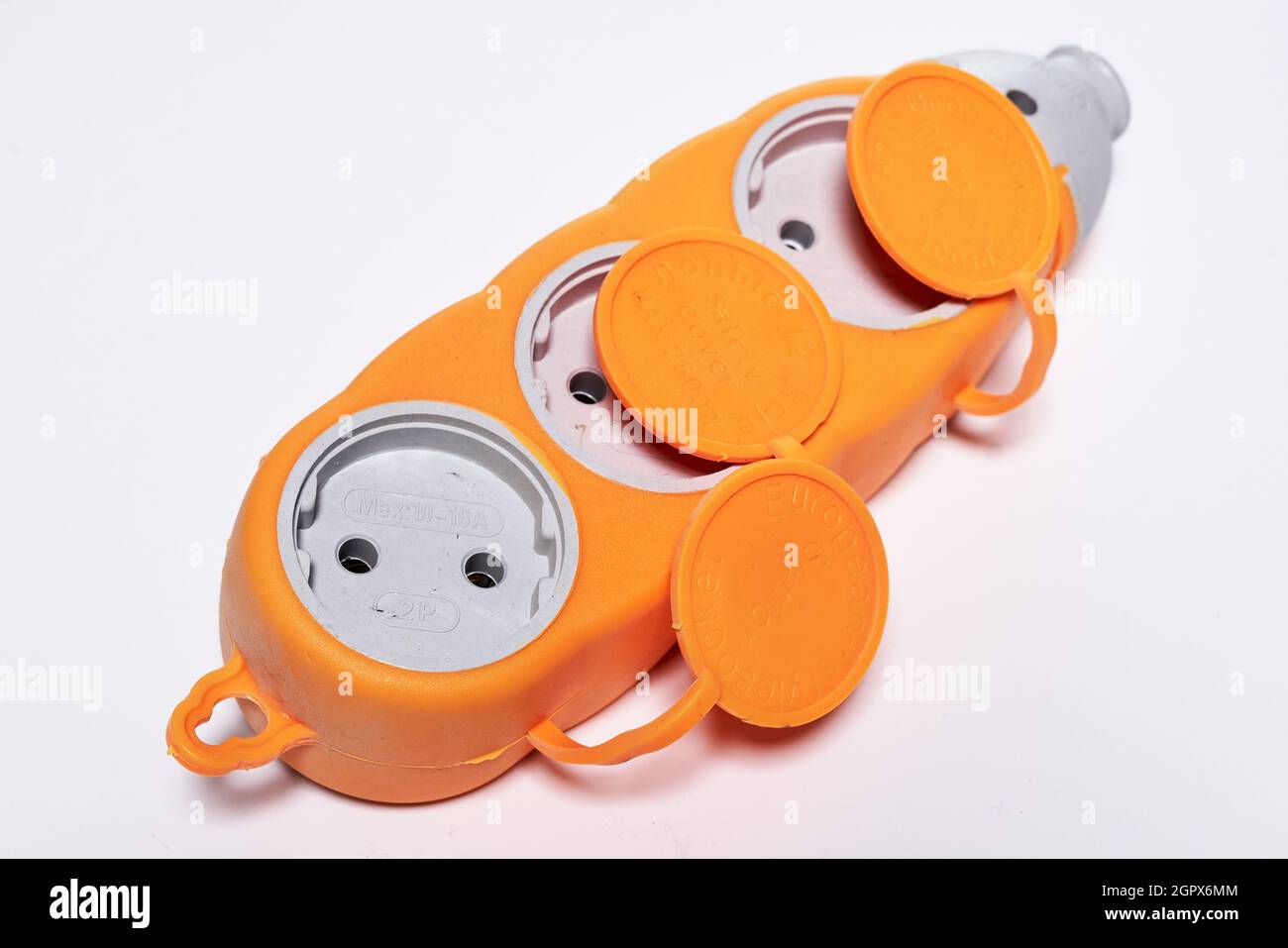 Orange extension block for three sockets isolated on white background ...