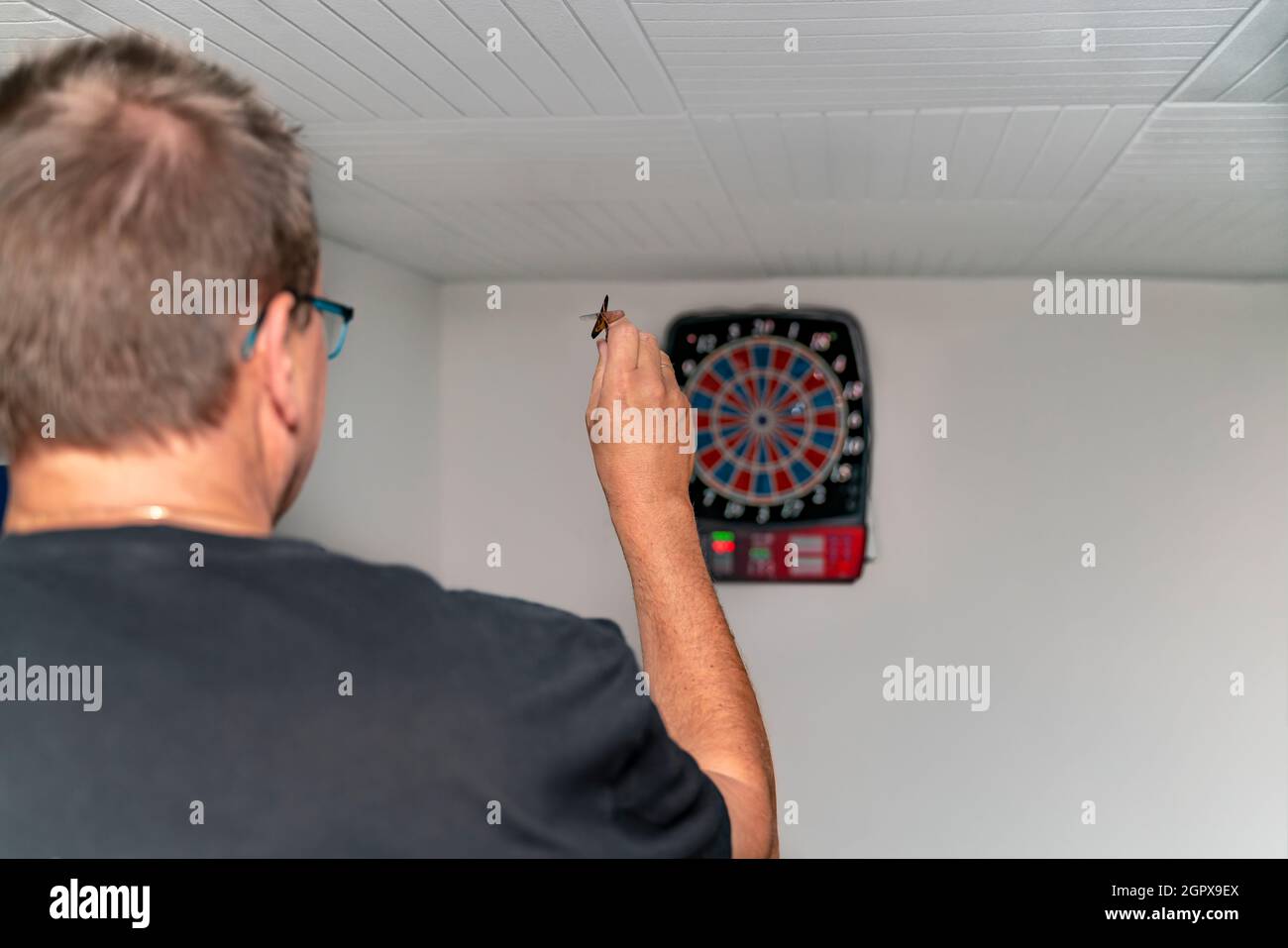 Darts in dartboard game throwing hi-res stock photography and images ...