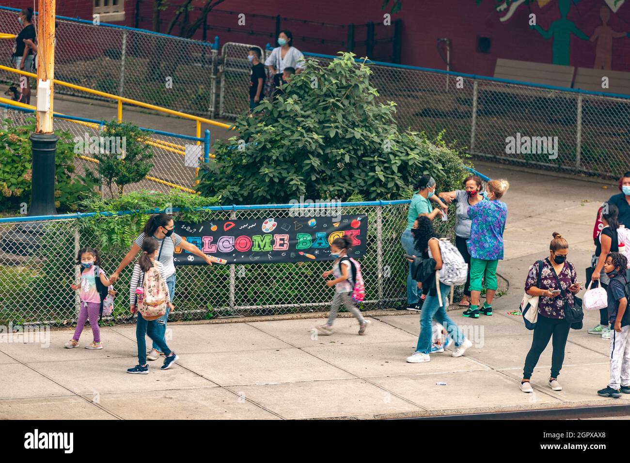 Parents and students line up outside of PS33 in Chelsea in New York on ...