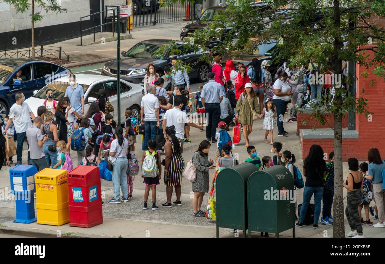 Parents and students line up outside of PS33 in Chelsea in New York on ...