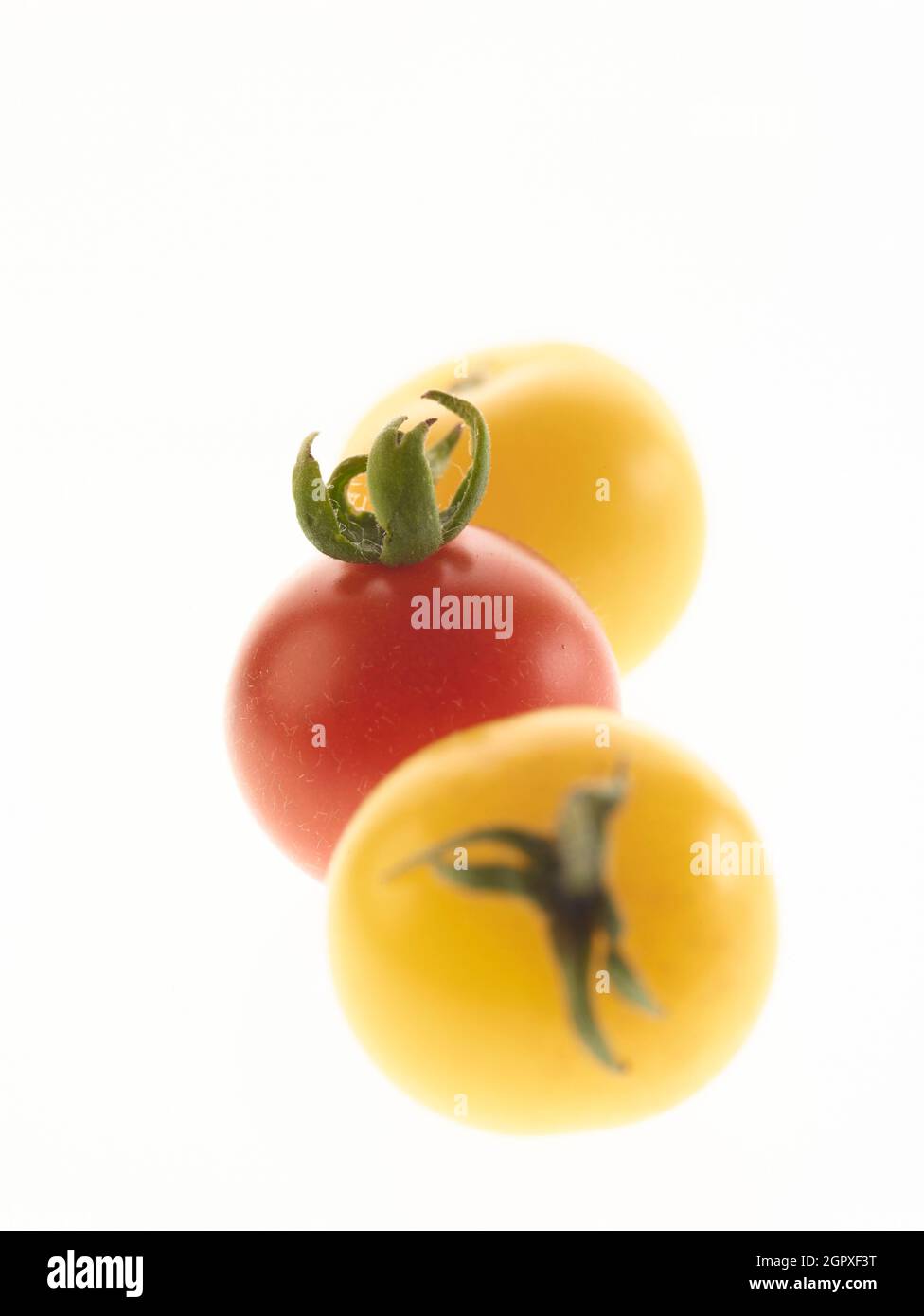 Bite sized tomato on white background, high resolution food ingredient ...