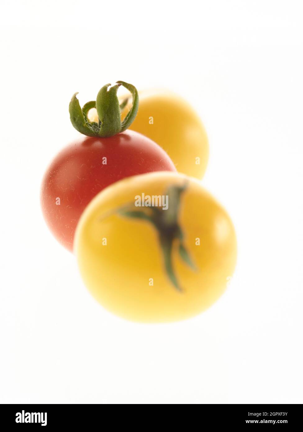 Bite sized tomato on white background, high resolution food ingredient ...