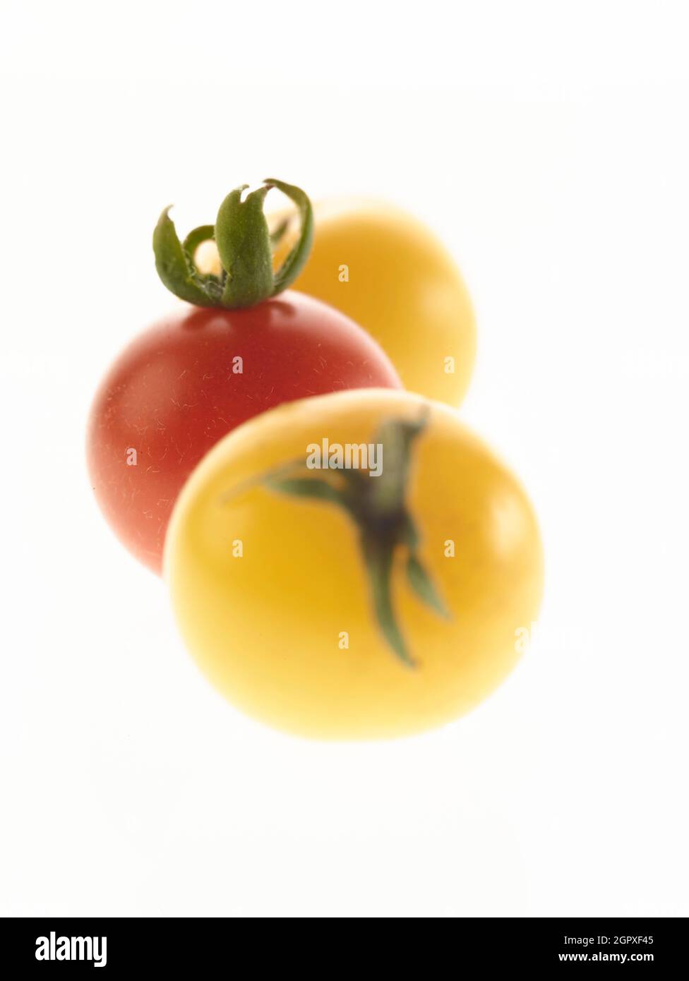Bite sized tomato on white background, high resolution food ingredient ...