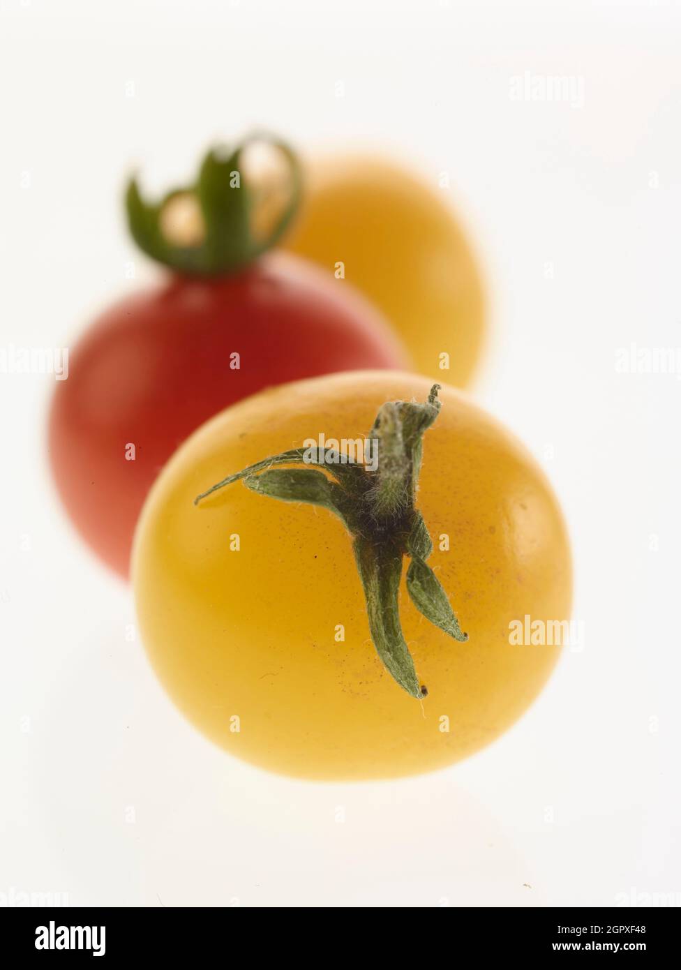 Bite sized tomato on white background, high resolution food ingredient ...