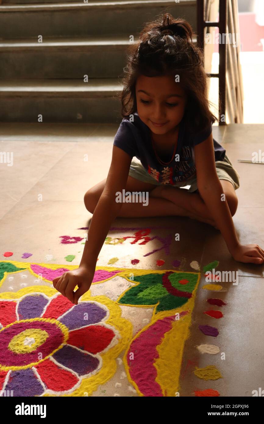 Girl making rangoli hi-res stock photography and images - Alamy