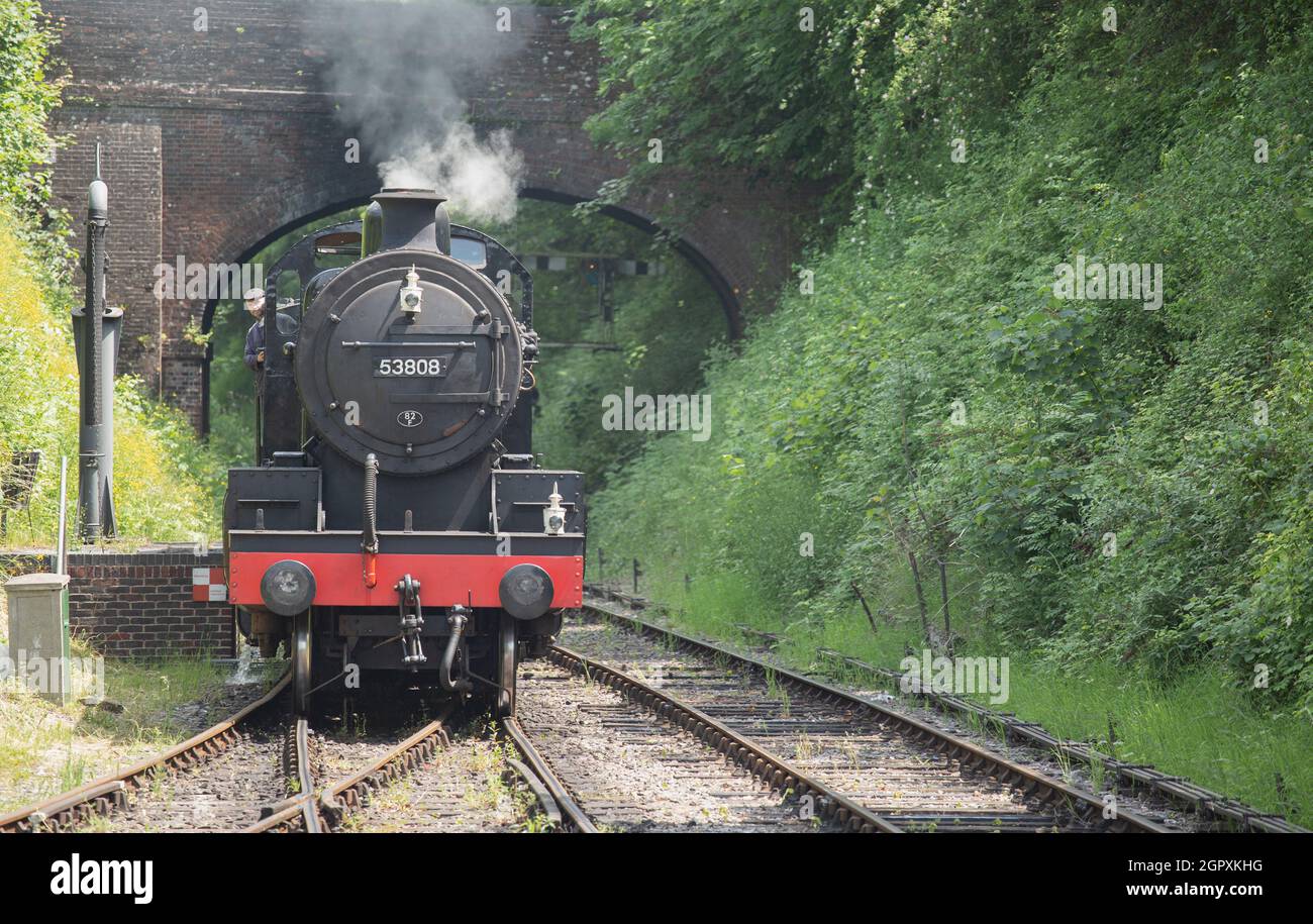 Steam Train coming under bridge into Alresford Railway Station in ...