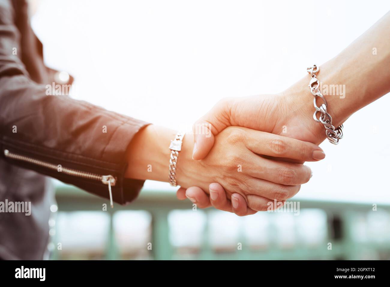 Boy girl shaking hands hi-res stock photography and images - Alamy
