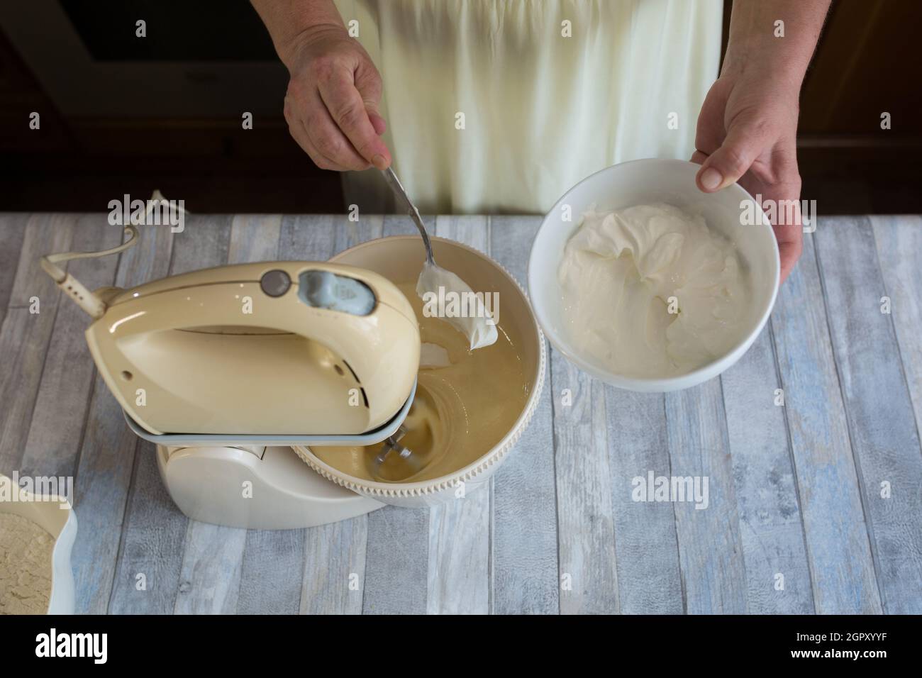 Step by step the process of making sour cream pie dough. Women's hands ...