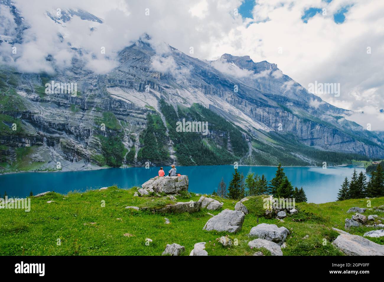 An attractive summer morning on the unique Oeschinensee Lake. A ...