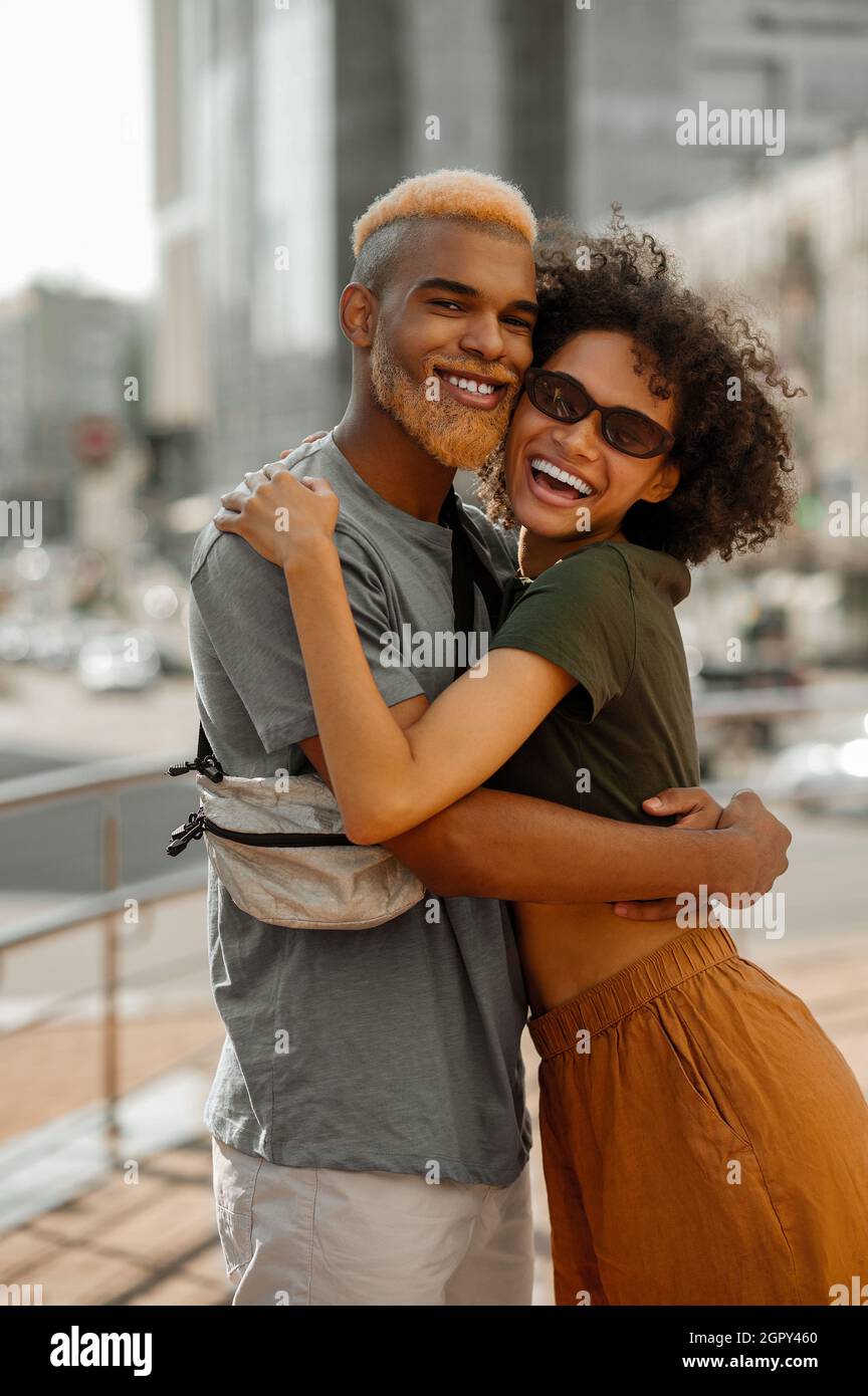 A man and a woman in the street looking romantic Stock Photo - Alamy