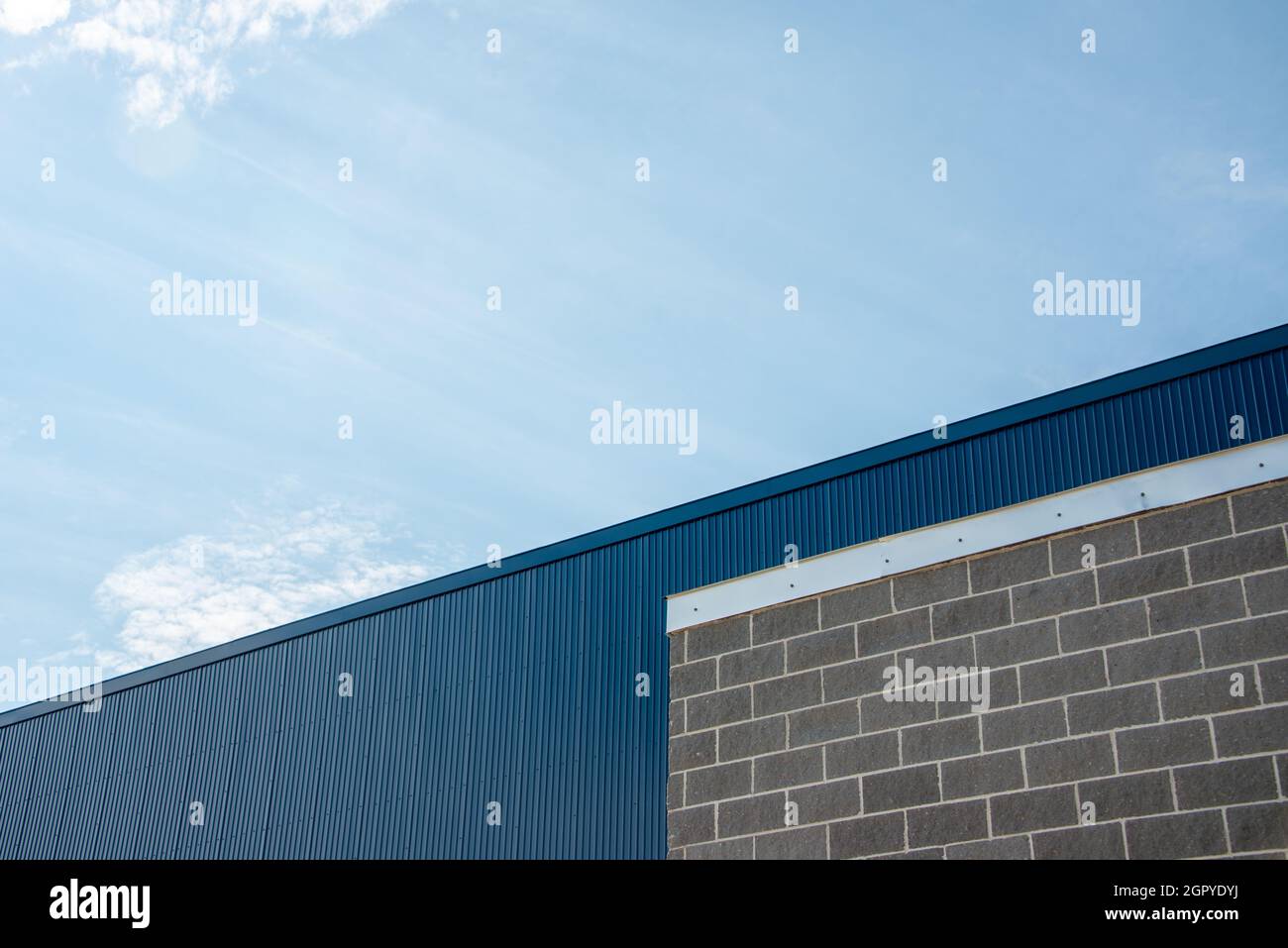 The exterior wall of a commercial building with grey brick, light gray ...