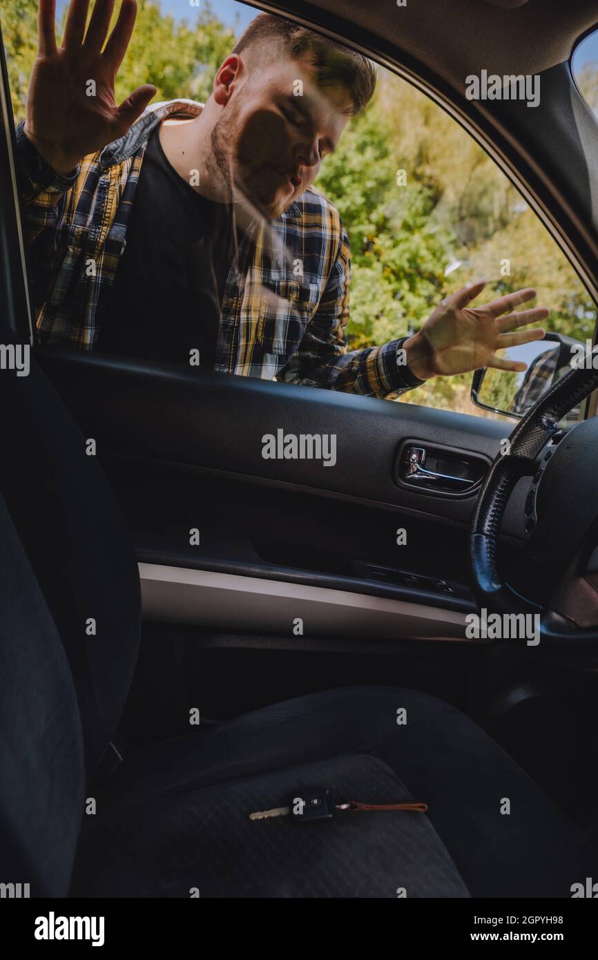 man locked car and forget keys inside. copy space Stock Photo - Alamy