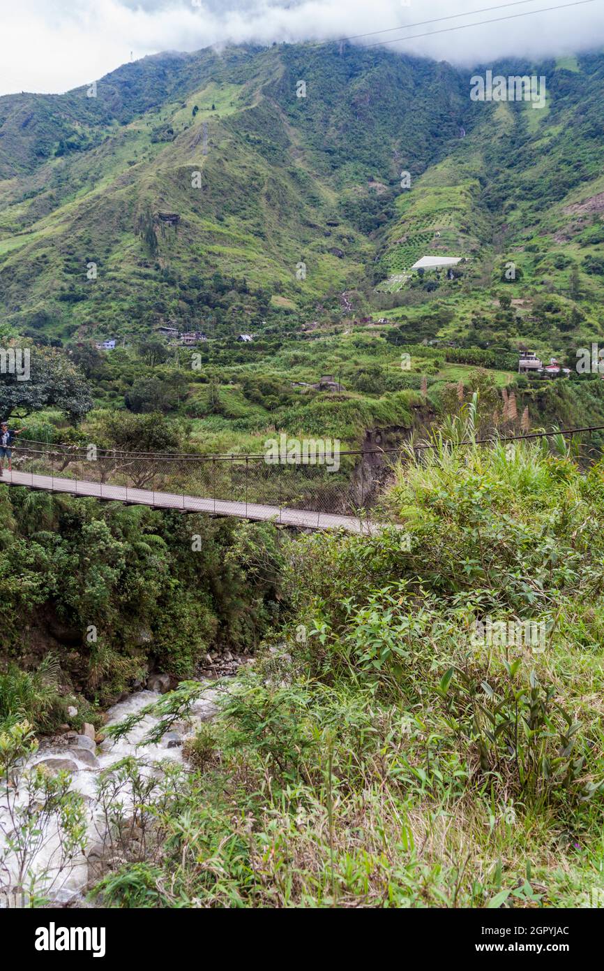 Suspension bridge over small stream in Ecuador Stock Photo - Alamy