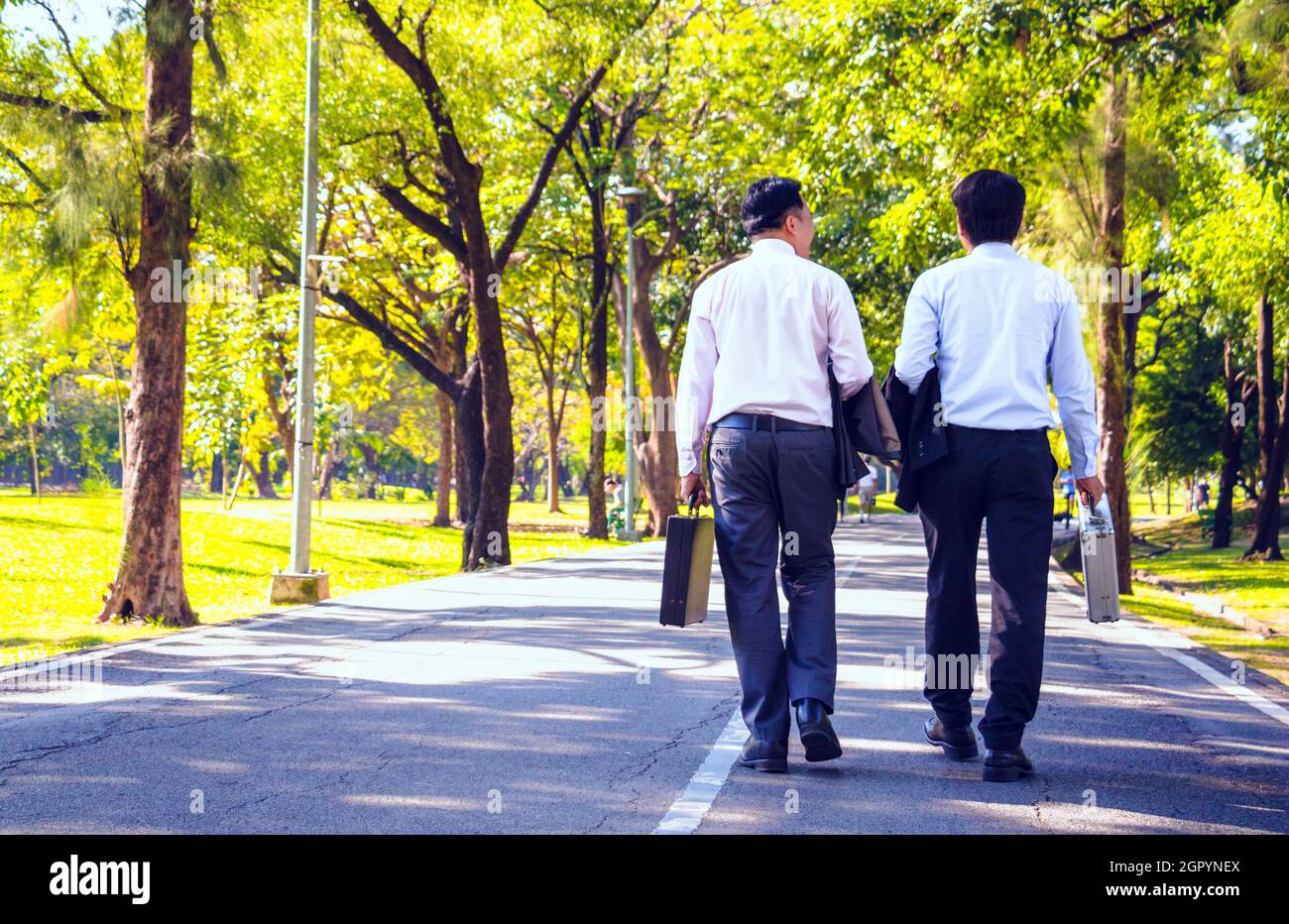 Back view of two men on the way to hi-res stock photography and images ...