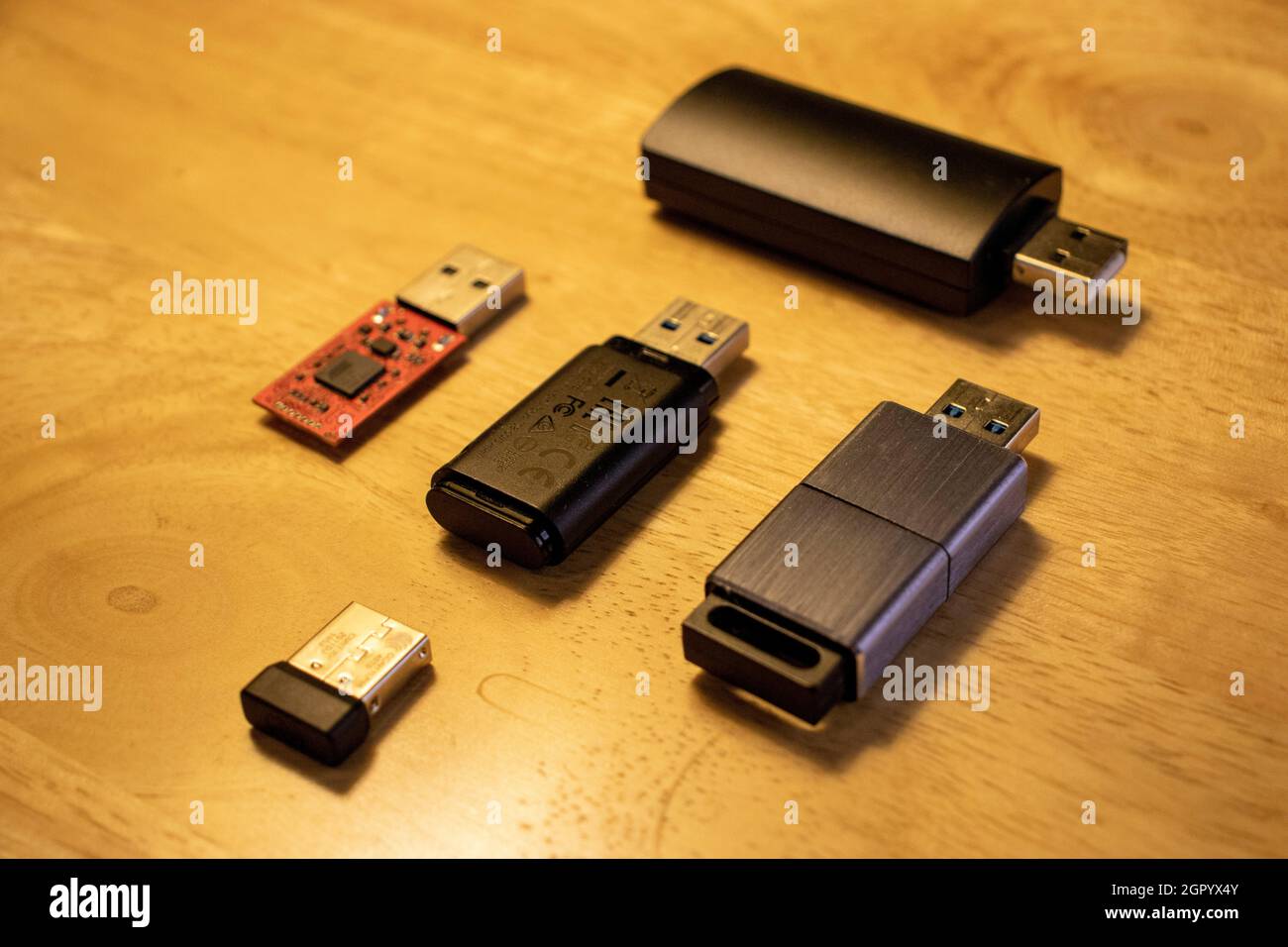 random items on a desk with a light colored wooden background Stock ...