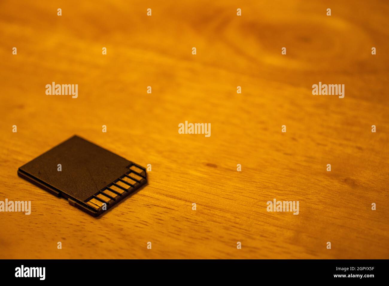 random items on a desk with a light colored wooden background Stock ...