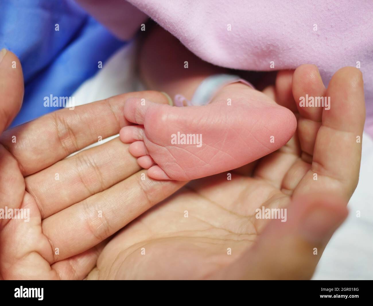 Baby hand foot mouth hi-res stock photography and images - Alamy