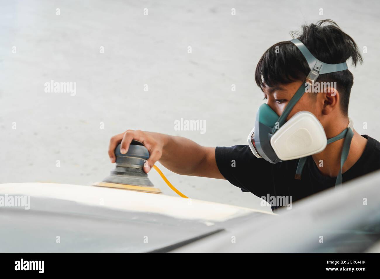Mechanic Wearing Mask Working On Car At Garage Stock Photo - Alamy