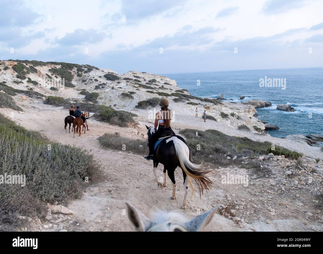 Riding horses at sunset hi-res stock photography and images - Alamy