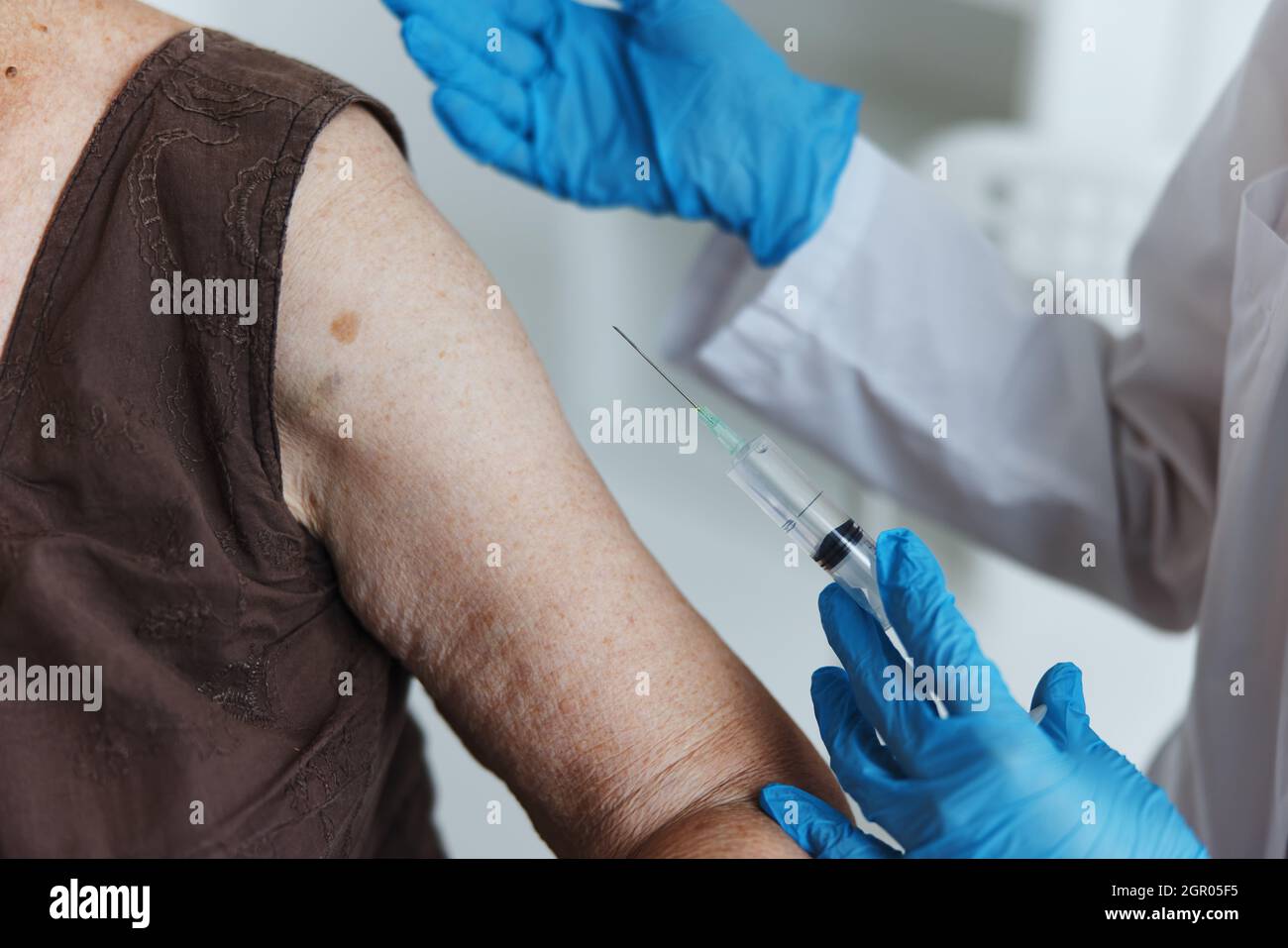 nurse makes an injection in the arm vaccine passport close-up Stock ...