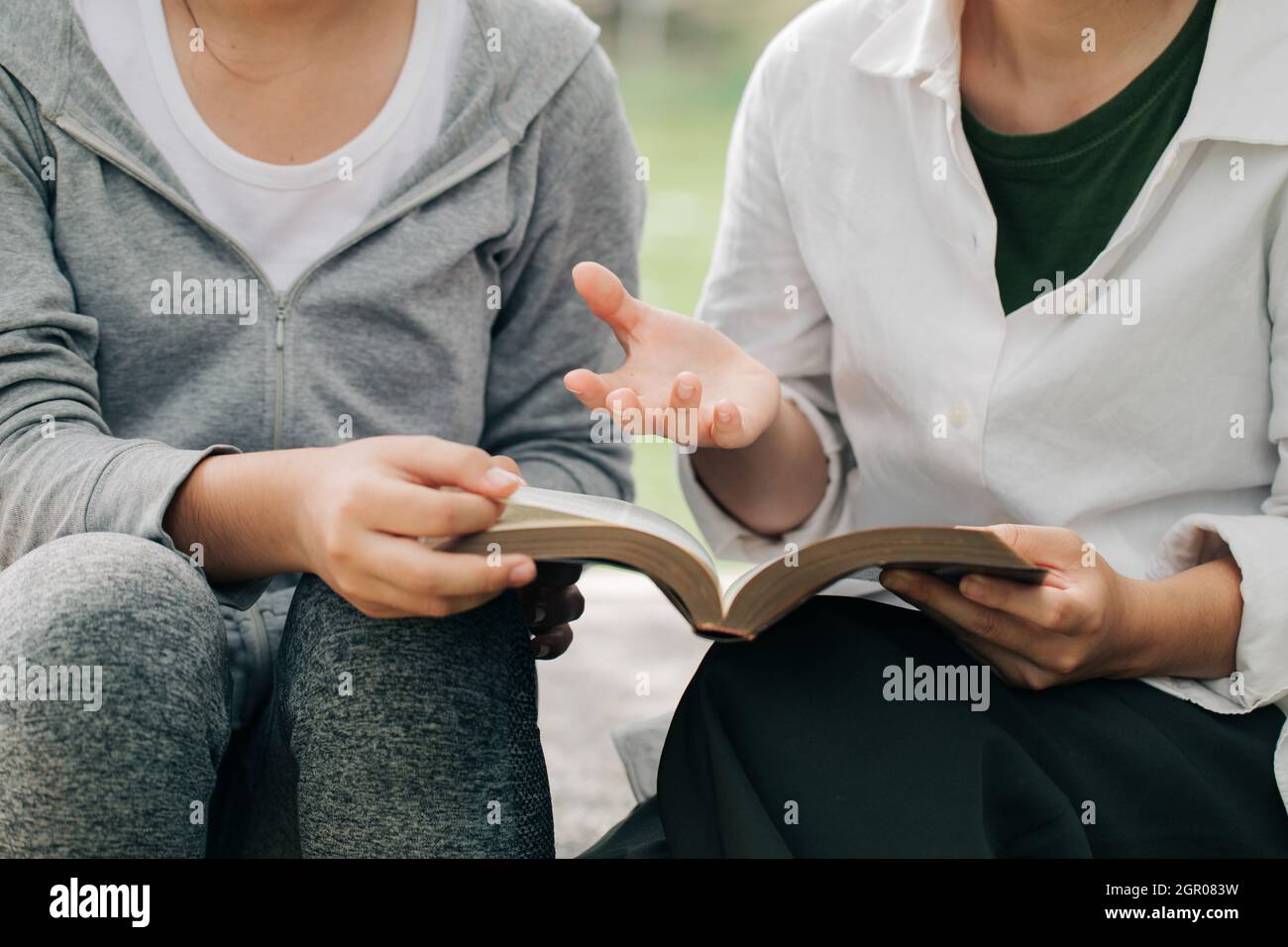 Two women talking bible open hi-res stock photography and images - Alamy