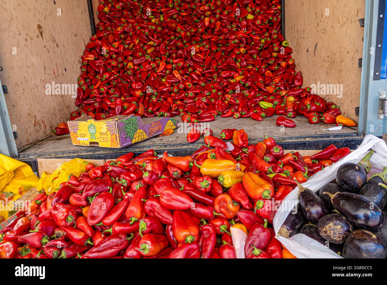 Red bell peppers sold from the filled truck at the street market bazar ...